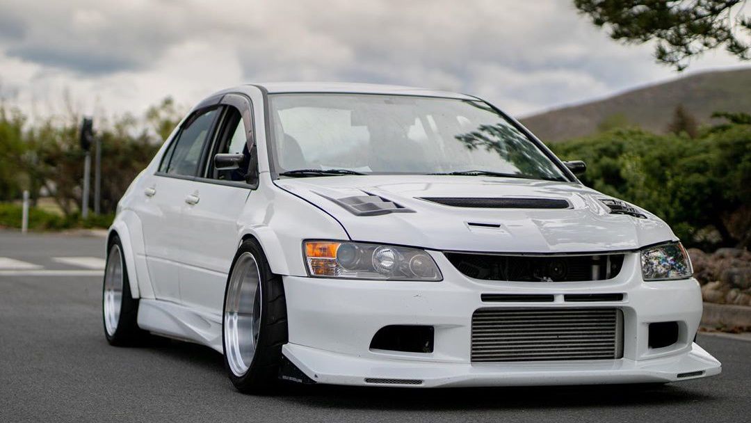 White 06 Mitsubishi Evo IX On TE37V Rays ModifiedX White 06 Mitsubishi Evo IX On TE37V Rays ModifiedX